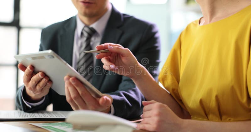 Business People Talking Using a Digital Tablet Sitting at Office Table ...