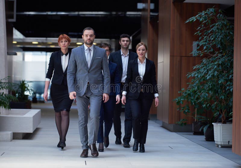 Team of Business People Walking Together with Modern Buildings in ...