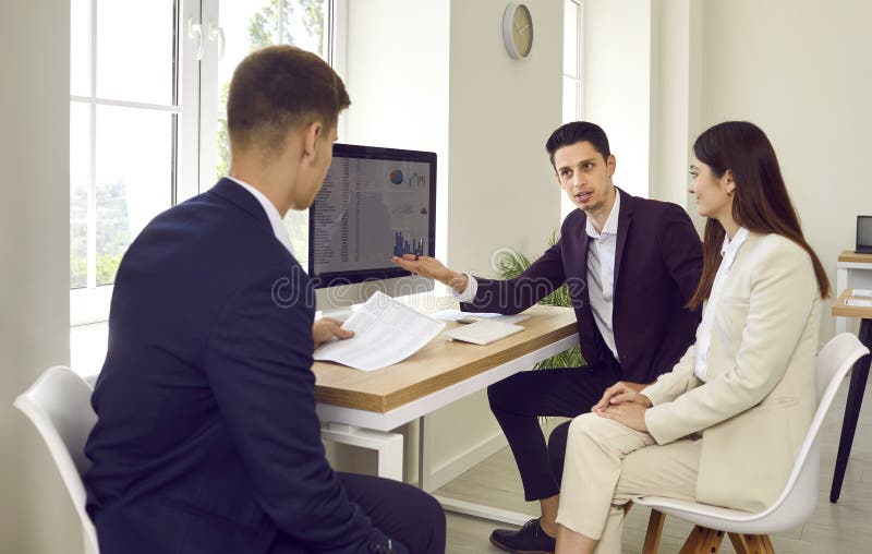 Business People Discussing Financial Diagram, Charts on Pc Computer ...