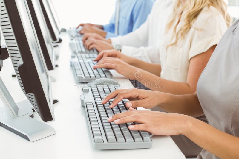 Business People with Headsets Using Computers in Office Stock Photo ...