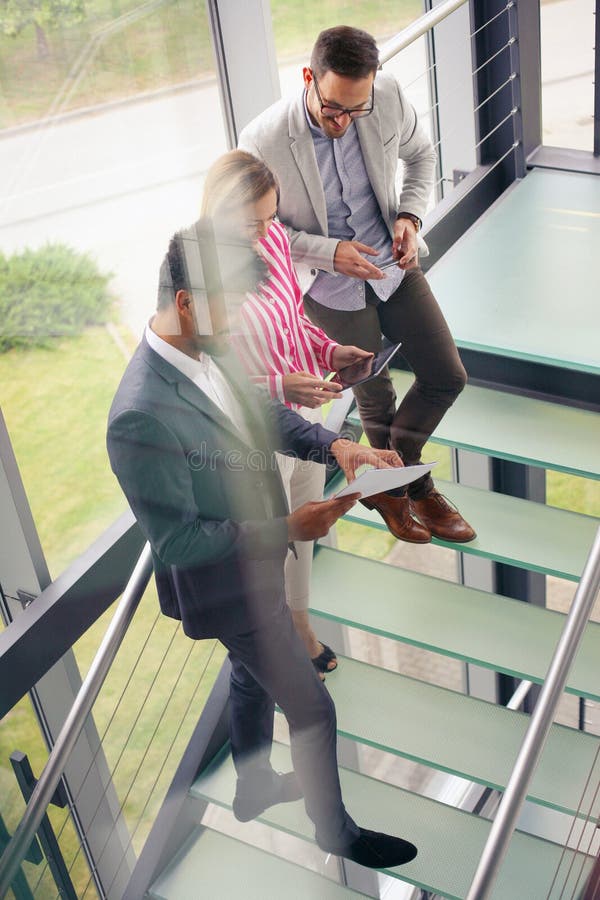 Business People Using Digital Tablet in Building Office. Busines Stock ...