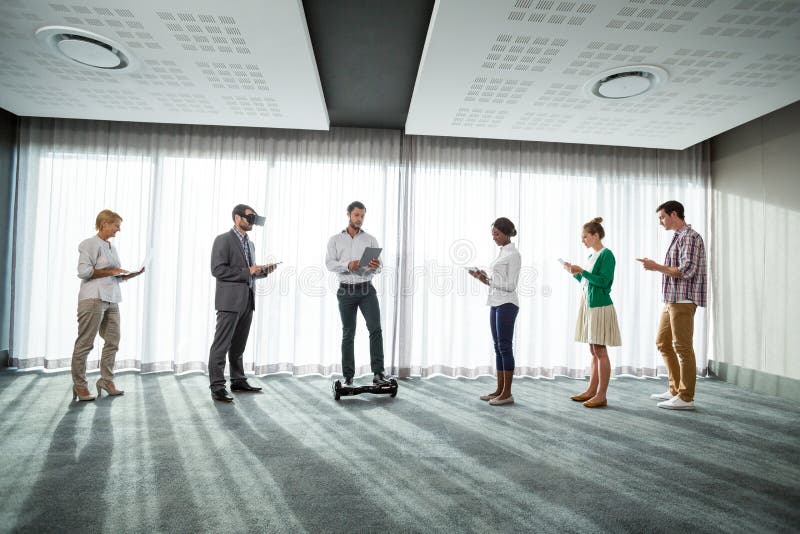 Business People Using Electronic Gadgets Stock Photo - Image of ...