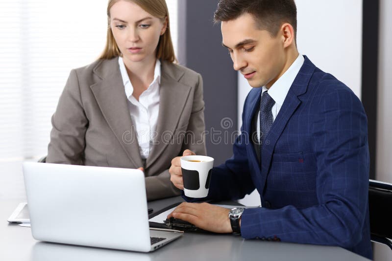 Business People Using Laptop Pc while Discussing Project in Office ...