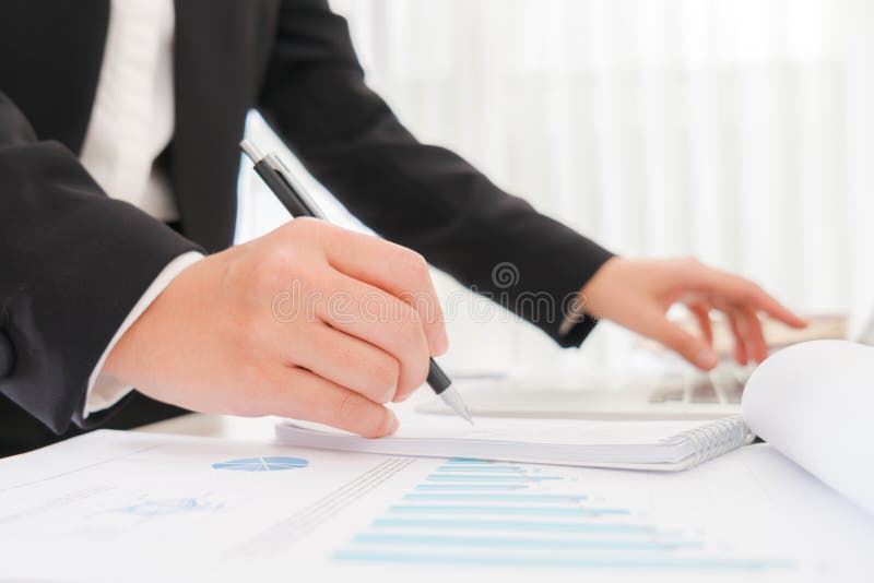 .Business People Using a Pencil Noting Over Laptop Stock Photo - Image ...