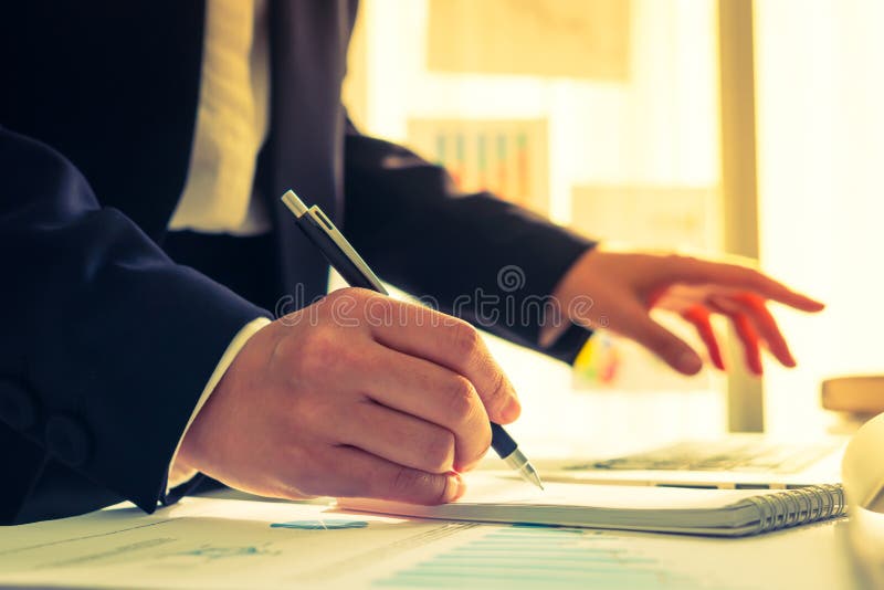 Business People Using a Pencil Noting Over Laptop Stock Photo - Image ...
