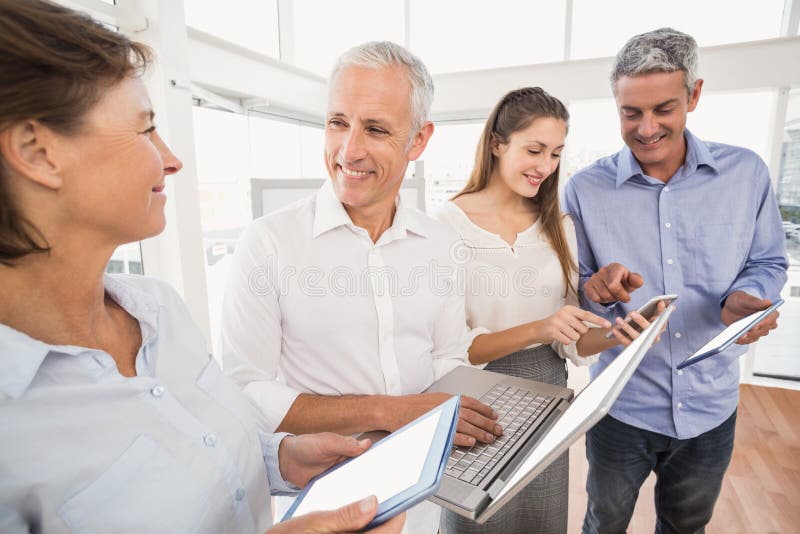 Business People Using Several Electronic Devices Stock Image - Image of ...