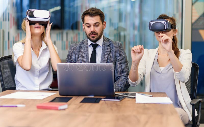Business People Using Virtual Reality Goggles during Meeting. Team of ...