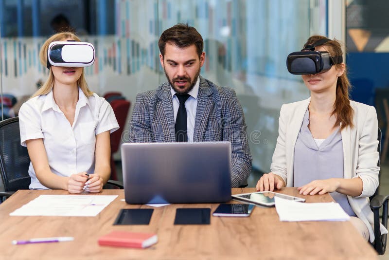 Business People Using Virtual Reality Goggles during Meeting. Team of ...