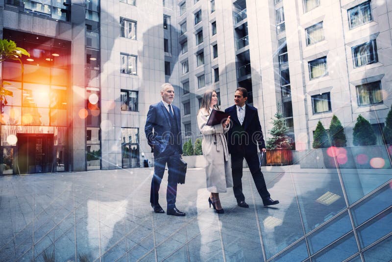 Business People Walk and Talk Outside the Office. Concept of Teamwork ...