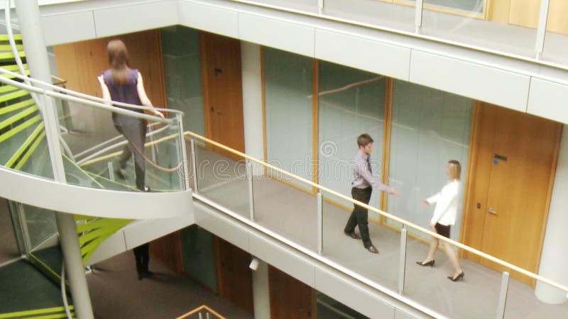 Business People Walking through Different Floors of a Building Stock ...