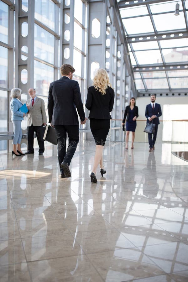 Business People Walking in Office Corridor Stock Photo - Image of ...