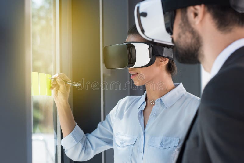 Business People Wearing Virtual Reality Headsets while Working in ...