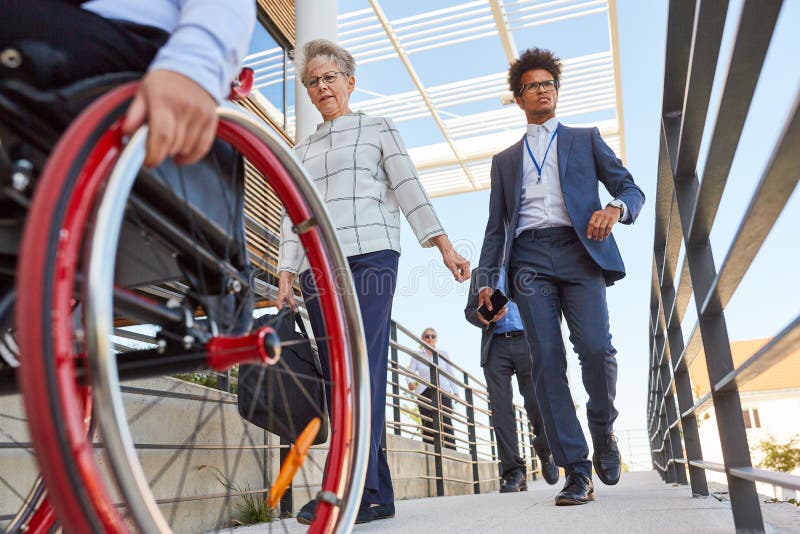 Business People and Wheelchair Users on a Ramp Stock Image - Image of ...