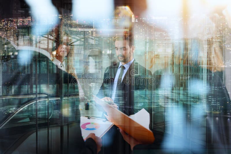 Business People Work Together in Office with Stats and Reports Stock ...