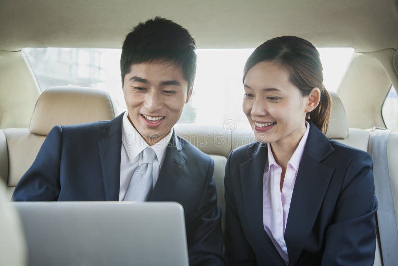 Business People Working in Back Seat of Car Stock Image - Image of ...