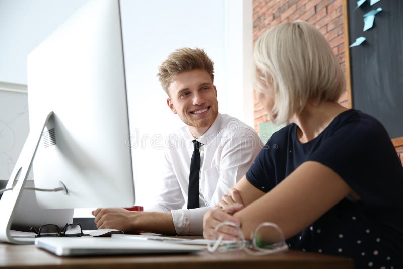 Business People Working on Computer at Table in Office Stock Image ...