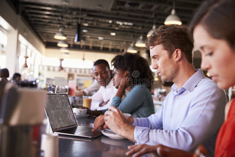 Business People Working at Counter in Coffee Shop Stock Image - Image ...