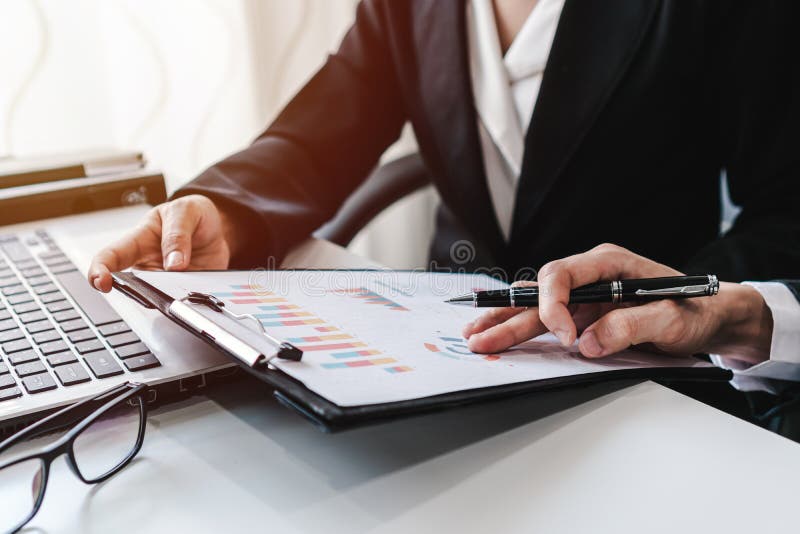 Business People Working on Desk Office with Marketing Graph Statistics ...