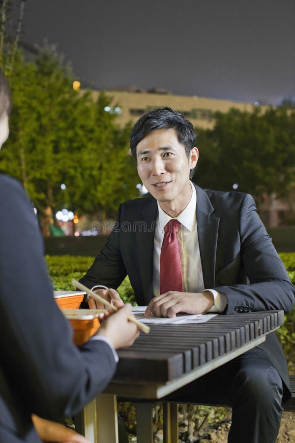 Business People Working while Having Dinner Stock Image - Image of ...