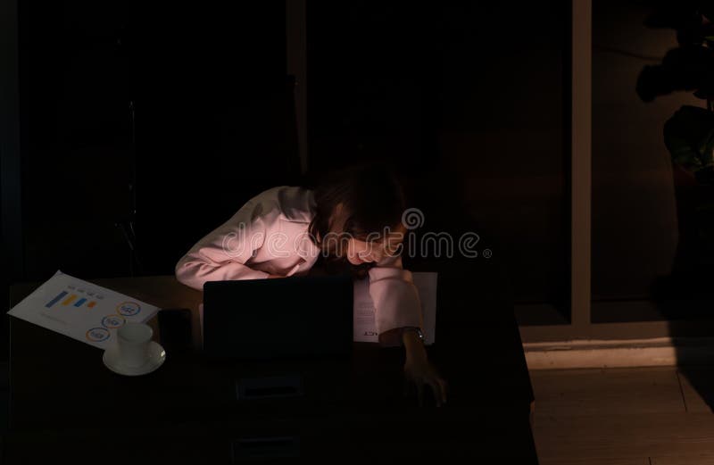 Business People Working with Laptop Computer in Dark Office Stock Photo ...