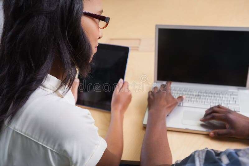 Business People Working on a Laptop and a Tablet Stock Photo - Image of ...