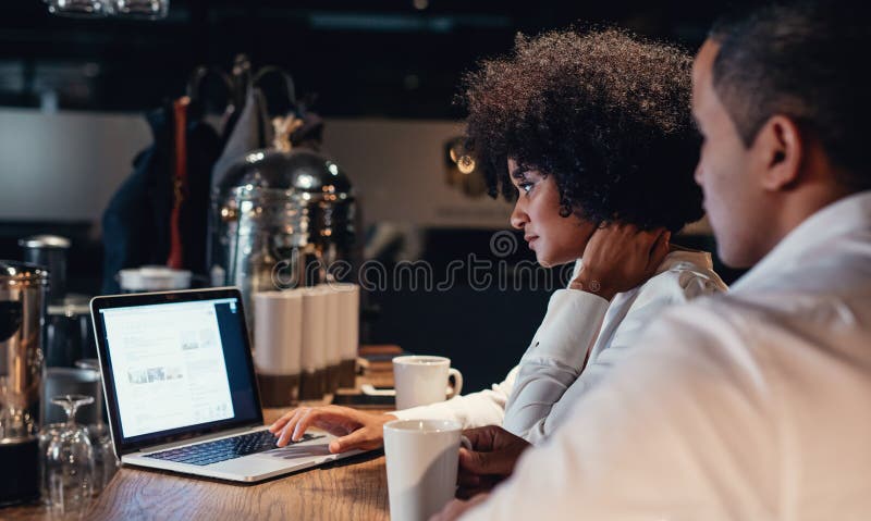 Business People Working Late on Laptop Stock Image - Image of females ...