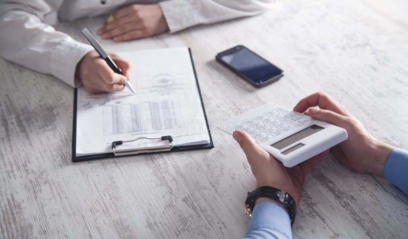 Business People Working in Office and Using Calculator Stock Image ...