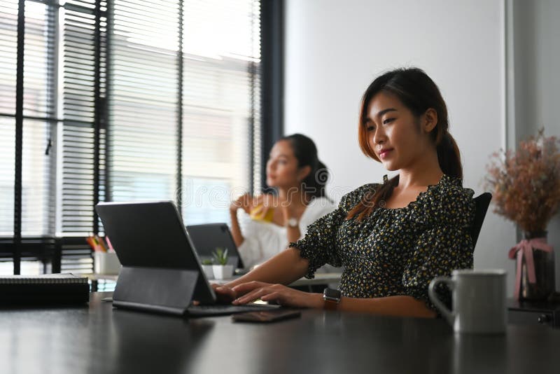 Business People Analyzing Financial Data on Computer Laptop Together ...