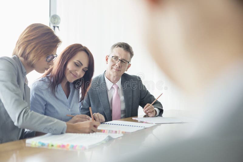 Business People Working Together at Conference Table Stock Image ...