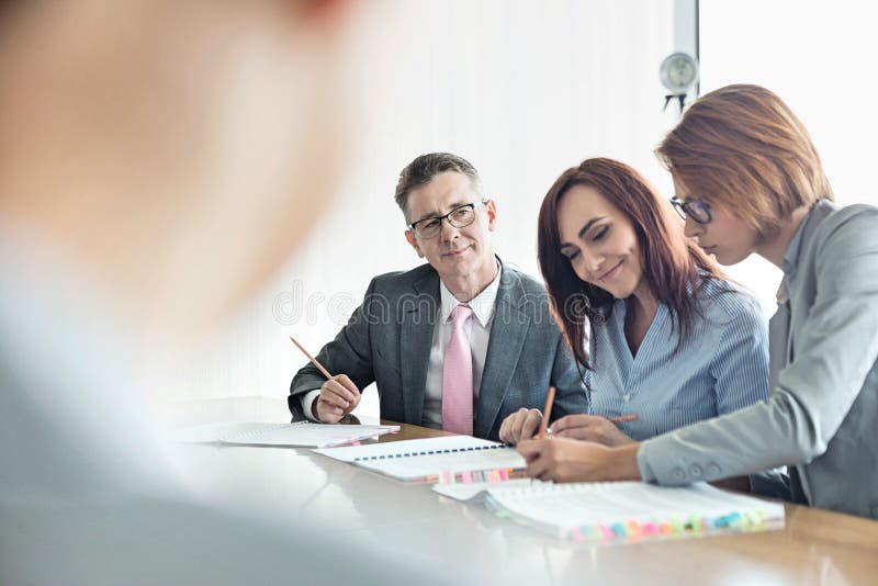 Business People Working Together at Conference Table Stock Image ...