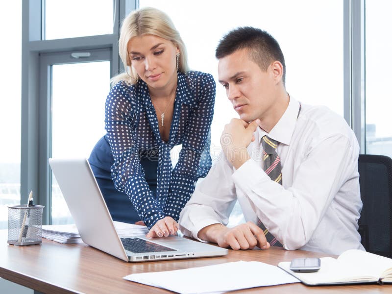 Business People Working Together in Office at Desk Stock Image - Image ...