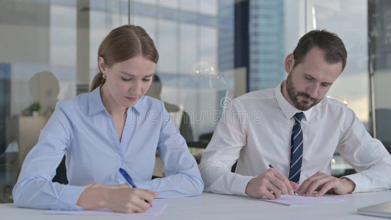 The Business People Writing Documents on Office Table Stock Image ...