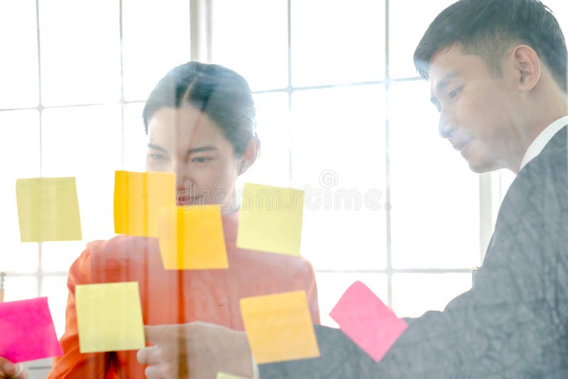 Business People Writing Ideas on Sticky Notes Stock Image - Image of ...