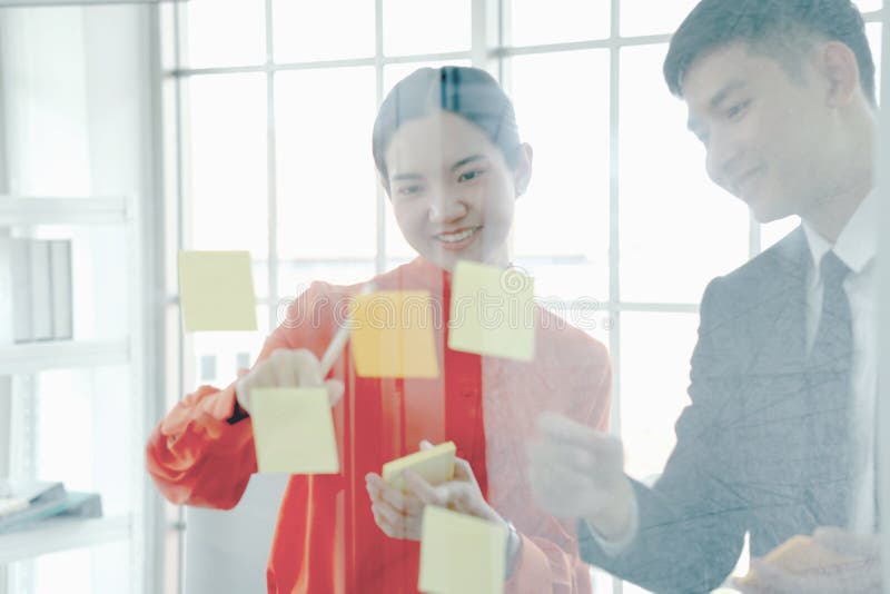 Business People Writing Ideas on Sticky Notes Stock Photo - Image of ...