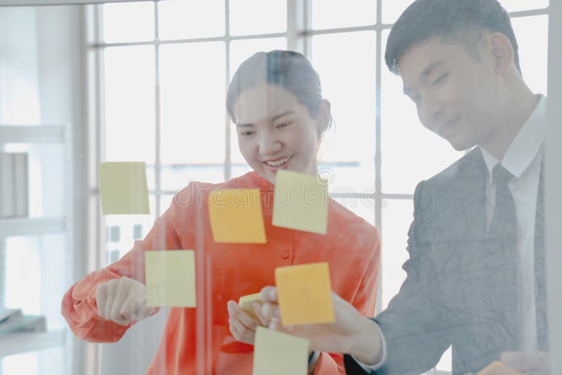 Business People Writing Ideas on Sticky Notes Stock Image - Image of ...