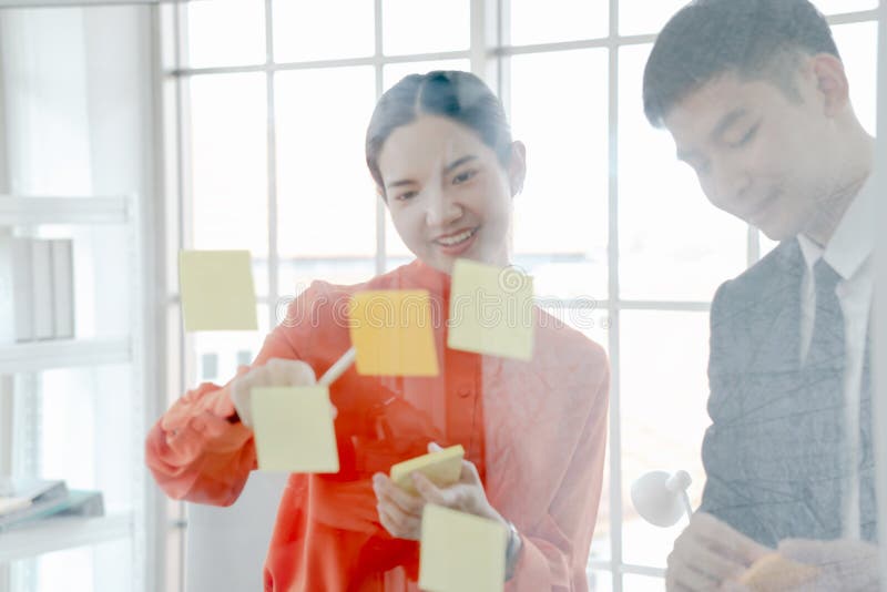 Business People Writing Ideas on Sticky Notes Stock Photo - Image of ...