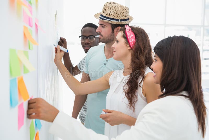 Business People Writing Ideas on Sticky Notes Stock Image - Image of ...