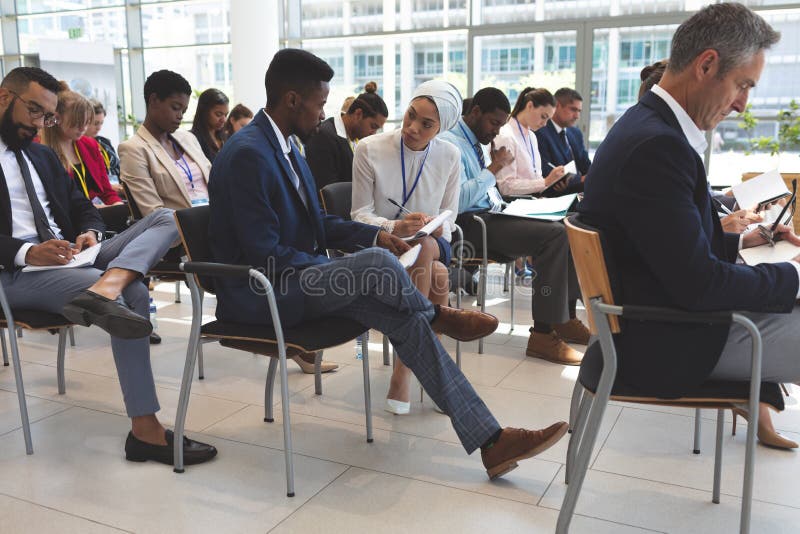 Business People Writing on Notepad during Seminar Stock Image - Image ...