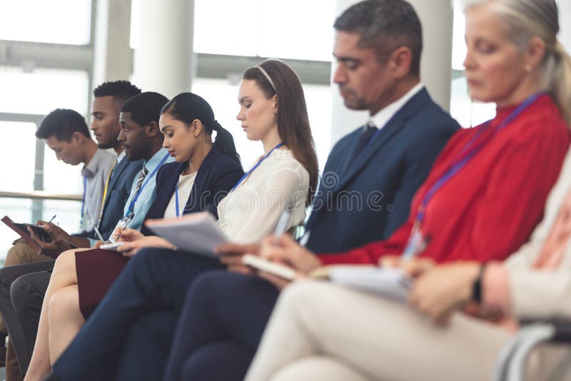 Business People Writing on Notepad in Business Seminar Stock Photo ...