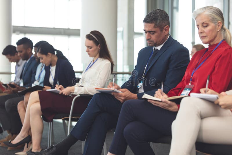 Business People Writing on Notepad in Business Seminar Stock Image ...