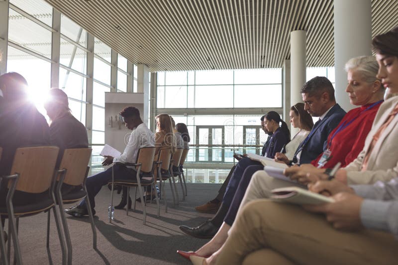 Business People Writing on Notepad in a Business Seminar Stock Photo ...