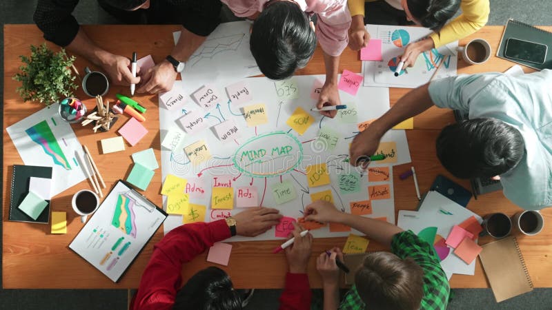 Business People Writing at Notes and Making Mind Map at Meeting ...