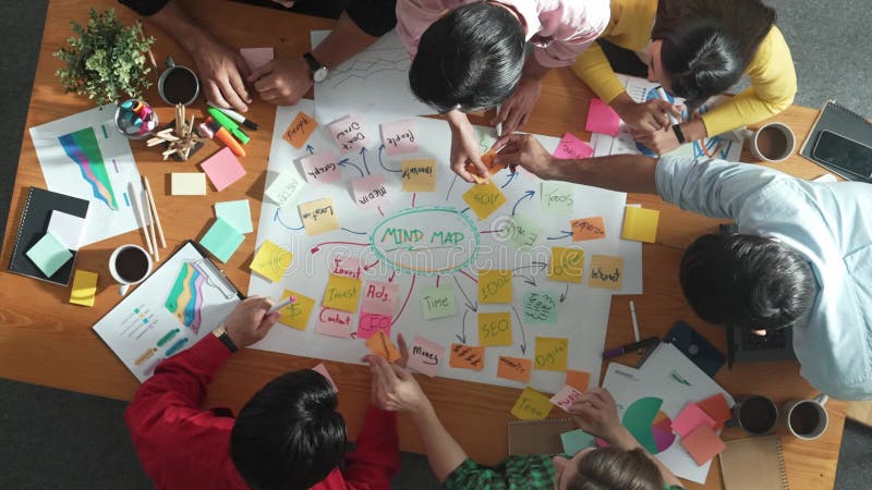 Business People Writing at Notes and Making Mind Map at Meeting ...