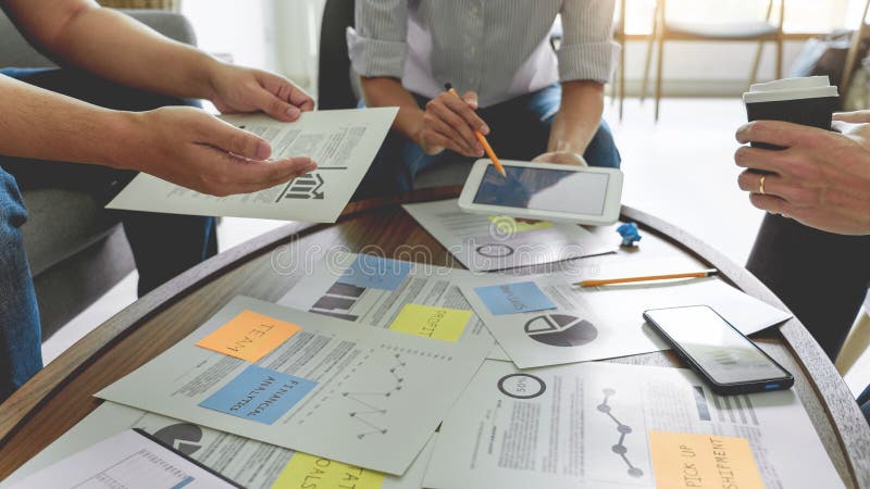 Business People Writing on Sticky Notes for Colleagues Thinking ...