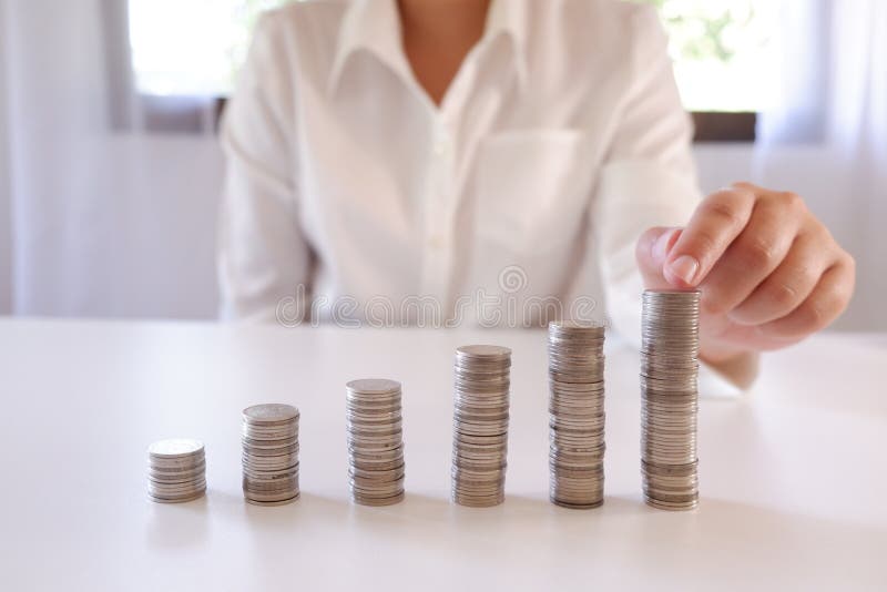 Business Person Placing Coin Over the Increasing Coins Stack Stock ...