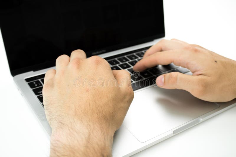 Business Person Using the Keyboard of a Laptop on a White Table. Person ...