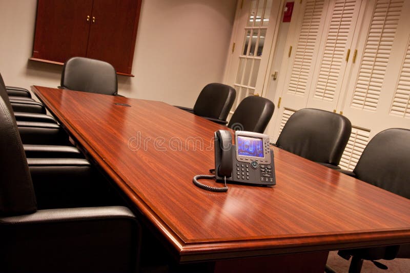 Business Phone on Conference Table Angled Stock Photo - Image of ...