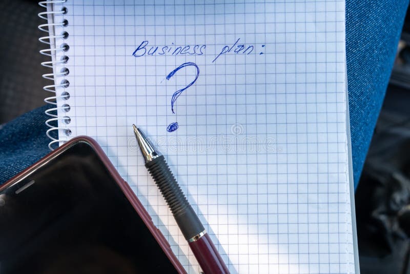 Business Plan and Question Mark Written on a Notebook. Reflections on ...