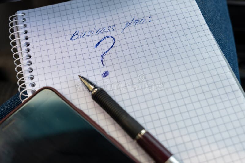 Business Plan and Question Mark Written on a Notebook. Reflections on ...