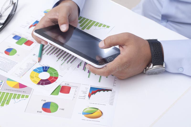 Businessman Working on Reports Stock Photo - Image of mobility ...